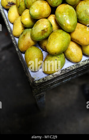 Delicious Mango fruits in basket. Colourful big mangoes in shades of ...