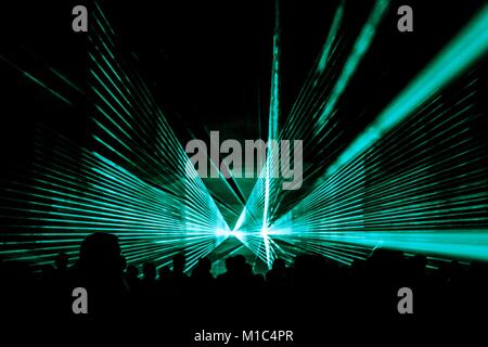 Turquoise laser show nightlife club stage shining sparkling rays ...