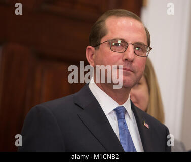 Alex Azar listens during his swearing in to be Secretary of the ...