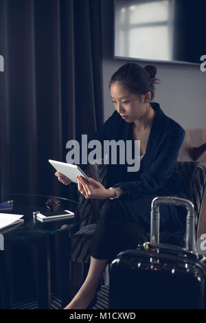 Beautiful young woman using digital tablet with digital pencil at cafe ...