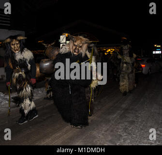 People run away in fear of wild elephants inside an army camp near ...