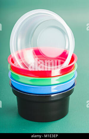 Plastic containers with liquid of different colors Stock Photo - Alamy