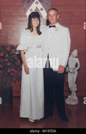 Prom couple posing for photograph Stock Photo - Alamy