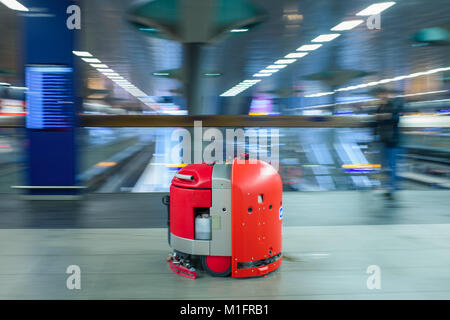 A Cleanfix RA660 navigator cleaning robot driving through a closedoff ...