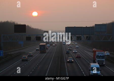 Sunset over the M62 motorway in winter, looking west from Scammonden ...