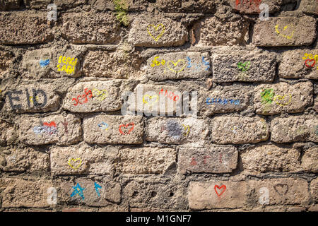 Brick inscription on brown brick. White letters building concept Stock ...