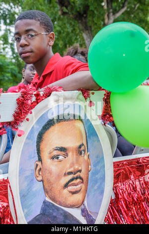 The Martin Luther King Jr. float passes the official review stand ...