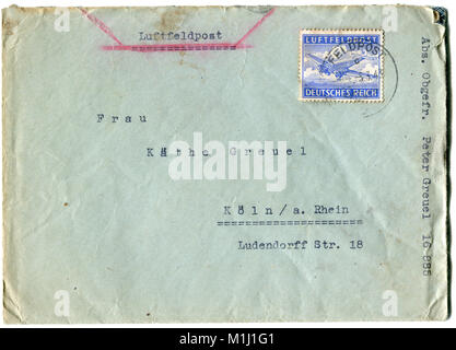 Old German postal envelope with a letter with stamps, postmark, with ...