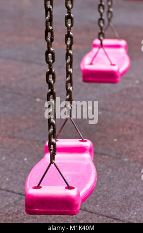 Close-up of child plastic pink skateboard isolated on pavement against ...