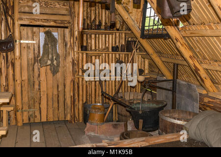 Medieval cabin of hunter with bed Stock Photo - Alamy