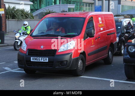 A RED PEUGEOT ROYAL MAIL DELIVERY VAN IN WELSH AND ENGLISH BILINGUAL ...