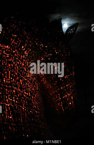 A blue moon rises over the Kelpies in Central Scotland Stock Photo - Alamy