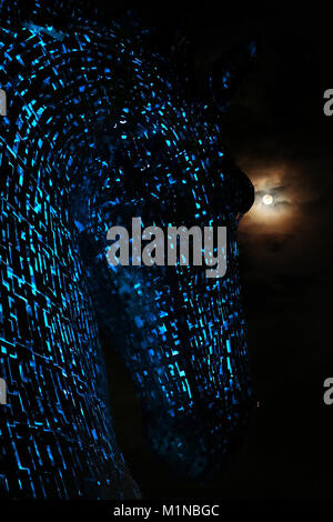 A blue moon rises over the Kelpies in Central Scotland Stock Photo - Alamy