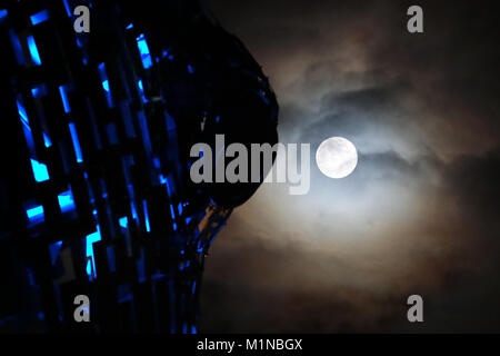 A blue moon rises over the Kelpies in Central Scotland Stock Photo - Alamy