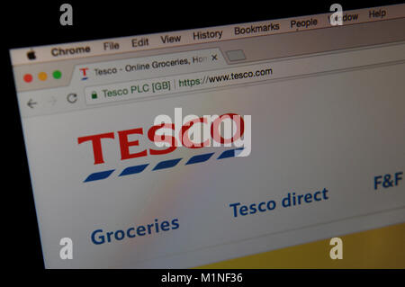 Supermarket Tesco's website is seen through a magnifying glass Stock ...