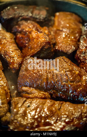 Simmering boneless short ribs Stock Photo - Alamy