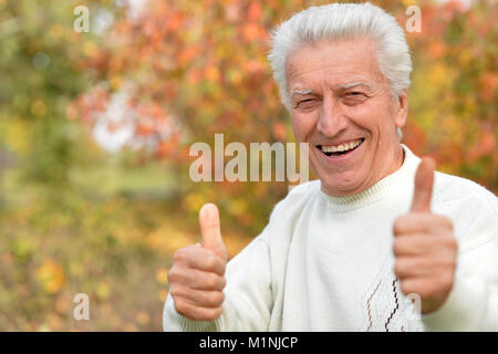 senior man showing thumbs up Stock Photo - Alamy