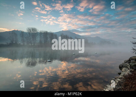 Clouds reflected in River Mera at dawn, Sorico, Como province, Lower ...