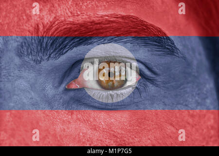 Human face painted with flag of Laos Stock Photo - Alamy