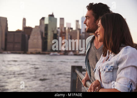 Two young men with four young women standing together and smiling Stock ...
