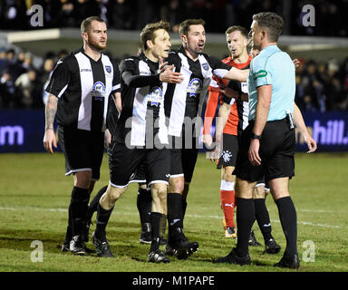 Fraserburgh players protest to referee Greg Aitken after he awards a ...