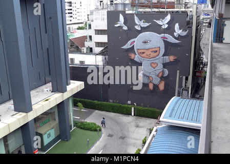A wall painting by artist Alex Face featuring his three-eyed trademark ...