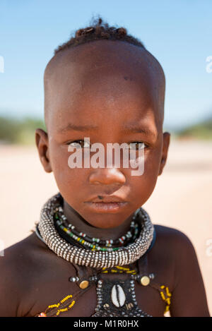 geography / travel, Namibia, Himba woman setting traditional skin cream ...