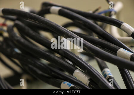 closeup of HDMI port and black cables in the background with white ...