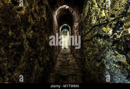 ancient dark secret passage of a castle Stock Photo - Alamy