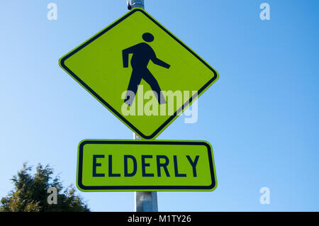 Caution elderly people road sign Stock Photo - Alamy