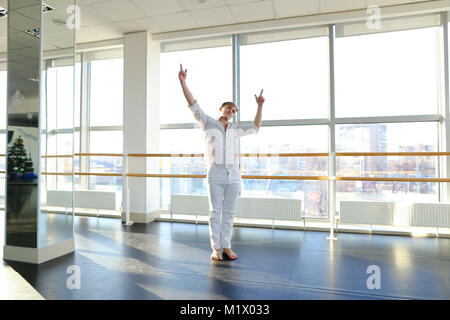 Dance school graduate making body movements Stock Photo - Alamy