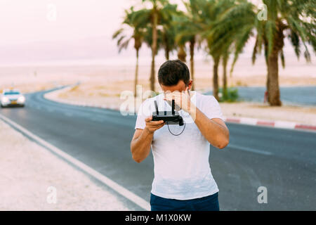 Guy controls drone with remote control Stock Photo - Alamy