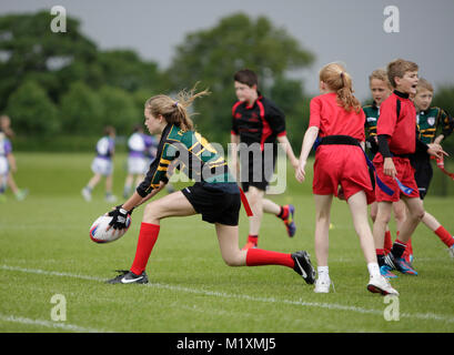 Girls and boys playing Tag Rugby in The midlands on a rainy Afternoon ...