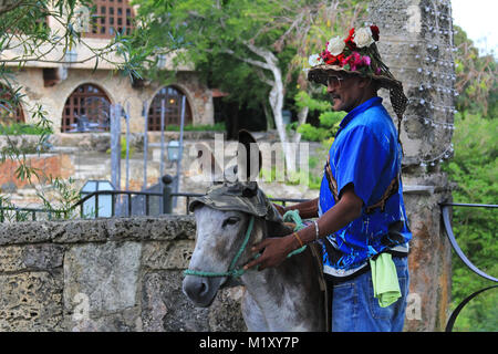 Dominican Republic, La Romana - 08 Jun 2021: Two men in hats and boots ...
