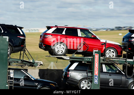 New Land Rover cars carried on a car transporter lorry, Birmingham, UK ...