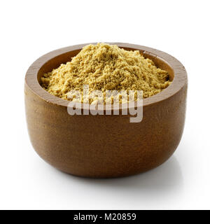 Finely dry Ginger powder in bowl with green leaves isolated on colored ...