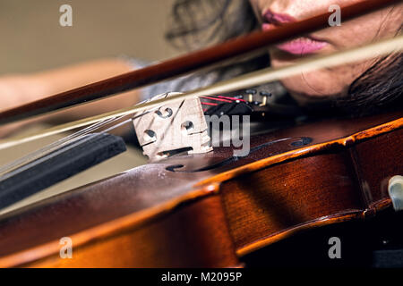 Women playing dusty violin, no effect added image Stock Photo - Alamy