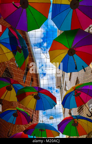 Colorful paper umbrellas hang all over the sky Stock Photo - Alamy
