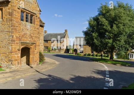 Mellow stone houses gathered around the green in the pretty village of ...