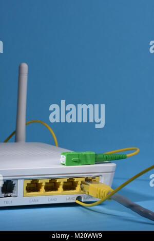 Wireless router with network patch cord and optical cable Stock Photo ...