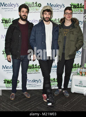Philadelphia, PA, USA - January 4, 2018: A couple with a red umbrella ...