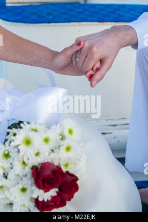 Wedding bouquet of daisies in the hands of the bride. Wedding in ...