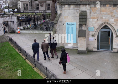 A sign pointing to the entrance of Blackstone Chambers, a firm of ...