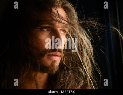 Portrait of a pensive handsome man over gray background Stock Photo - Alamy