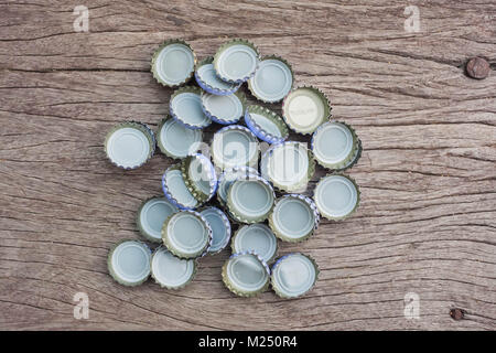 Beer caps on wooden background. Top view, copy space Stock Photo - Alamy