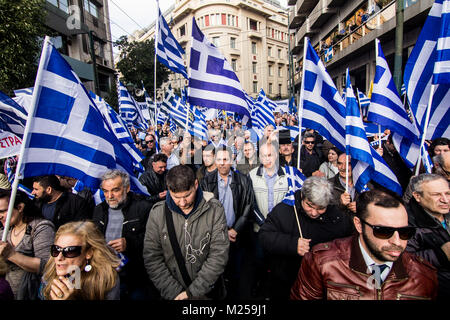 A protester seen holding a flag during the demonstration. Thousands of ...