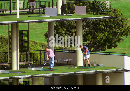 Golfers on the multi-level driving range at Moore Park Golf Course in ...