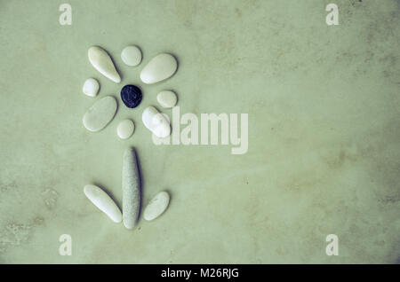 flower made from small pebbles Stock Photo - Alamy