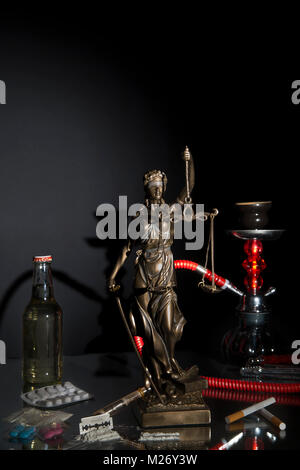 Legal and illegal intoxicants - Justitia statue in the midst of ...
