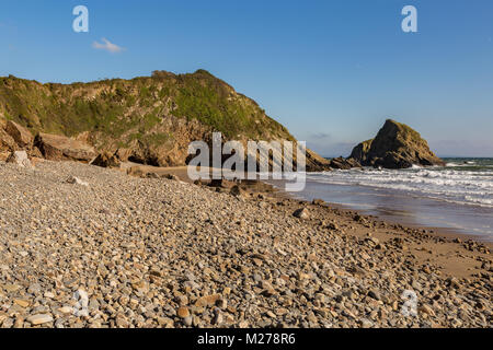 Pebble beach and cliffs at Monkstone Beach near Saundersfoot in ...